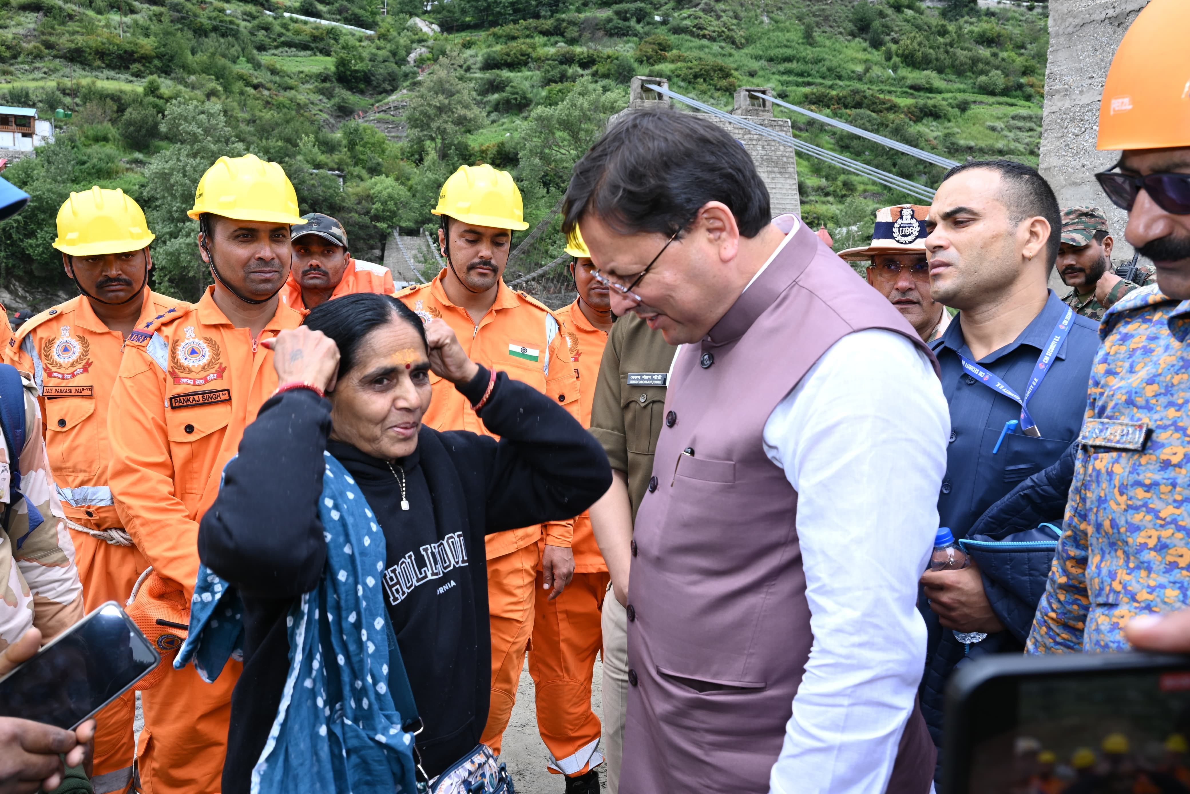 Uttarkashi Flood Woman Tore Her Saree And Tied A Rakhi To Cm Dhami During His Visit In Disaster ...