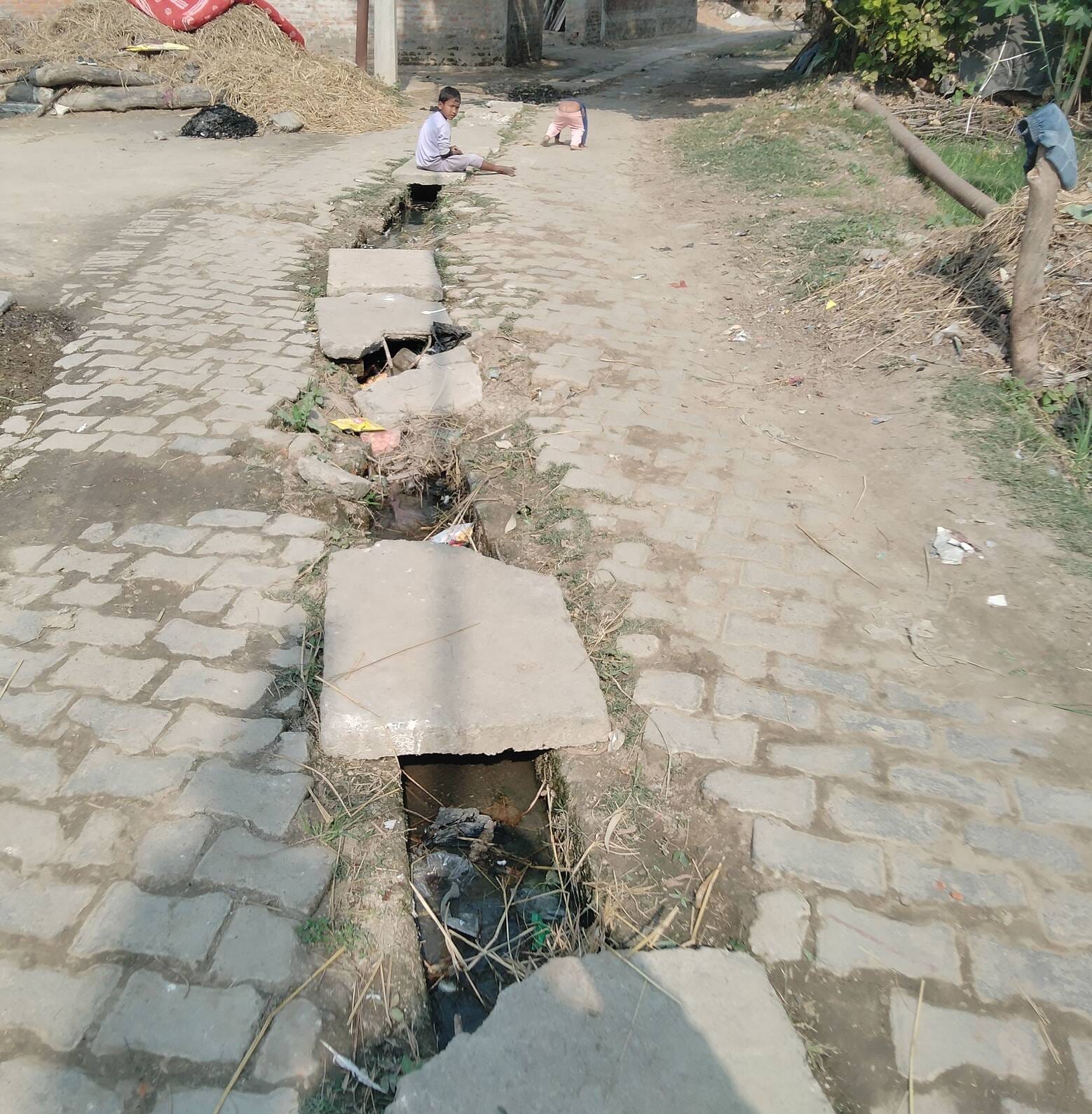 Broken Manhole Covers In The Middle Of The Road, Causing Pedestrians To ...