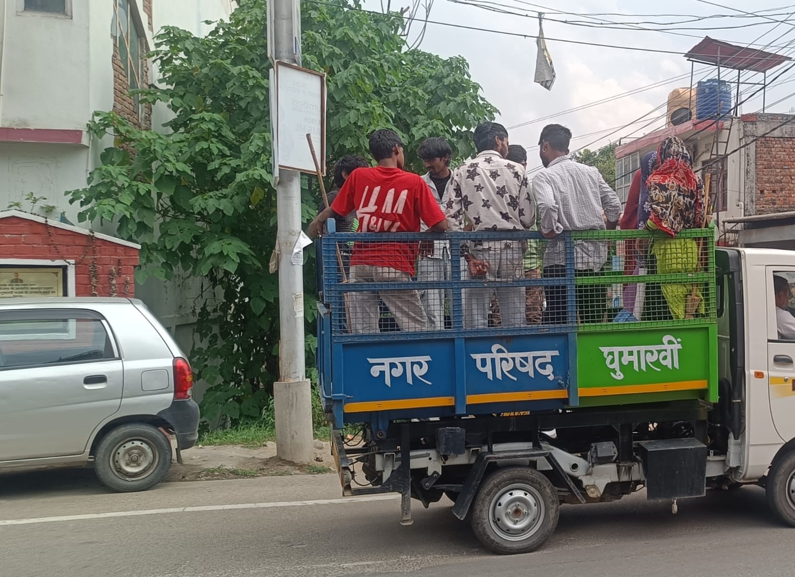 Sanitation Workers Traveling In A Garbage-hauling Vehicle. - Bilaspur ...